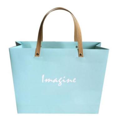 China Blue Color Shopping Clothing Paper Bags Custom Logo Printed OEM Service for sale
