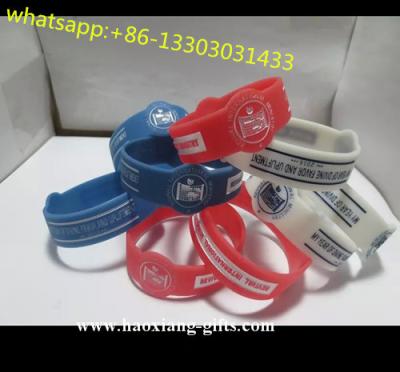 China cheap promotional uv sensitive sport silicone bracelet with custom logos for sale