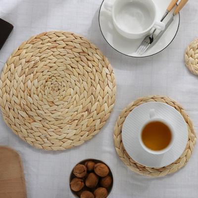 Cina Stuoie di posto tessute sottopiatti di Hyacinth Placemats Round Braided Rattan dell'acqua in vendita