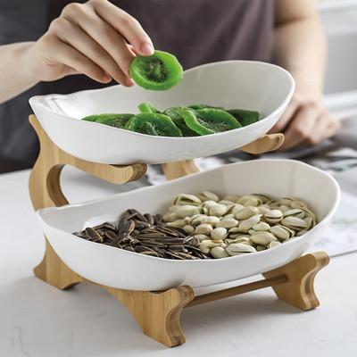 Cina Ciotola per frutta in ceramica bianca verde 2 3 livelli con supporto in legno di bambù per bancone da cucina in vendita