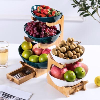 Cina Ciotola per frutta in ceramica bianca verde 2 3 livelli con supporto in legno di bambù per bancone da cucina in vendita