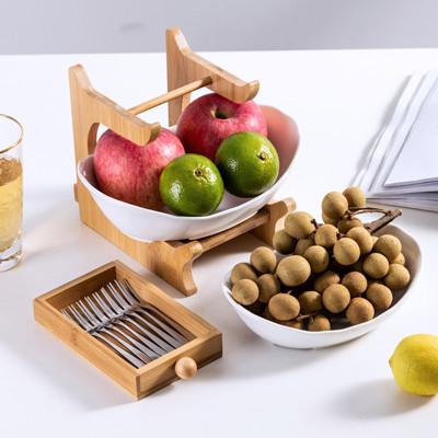 Cina Ciotola per frutta in ceramica bianca verde 2 3 livelli con supporto in legno di bambù per bancone da cucina in vendita