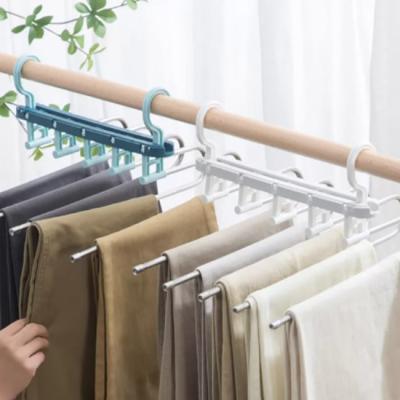 China Espaço dos eletrodomésticos que salvar o gancho de dobramento plástico que seca cremalheiras para a roupa à venda