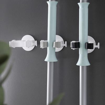 Cina Strumento autoadesivo di organizzazione della pinza di presa del supporto della scopa e di zazzera per il giardino domestico in vendita