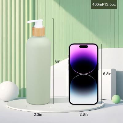 China 400ml 500ml Soft Touch Cosmetic Squeeze Bottle With Bamboo Lid For Shampoo Body Butter Lotion for sale