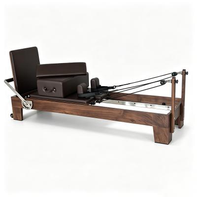 China Compact Solid Walnut Wood Wooden Pilates Reformer Bed Equipment For Rehabilitation Gym Training for sale