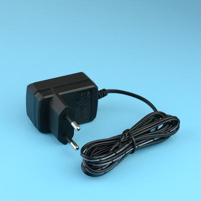 China Toy Electric Vehicle Switching AC DC Power Adapter 9V 10V 11V 11.5V 850mA 1100mA 1.2A 1.3A for sale