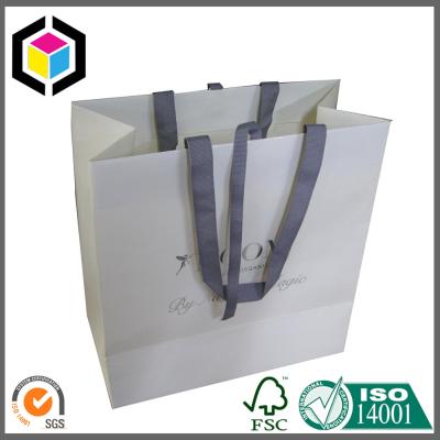 China Creative Ribbon Gift Paper Bag; Silver Logo Small Recyclable Kraft Paper Bag for sale