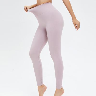 Cina 10 pantaloni di yoga di controllo della pancia della vita di allenamento di colori alti delle donne senza cuciture nude delle ghette in vendita