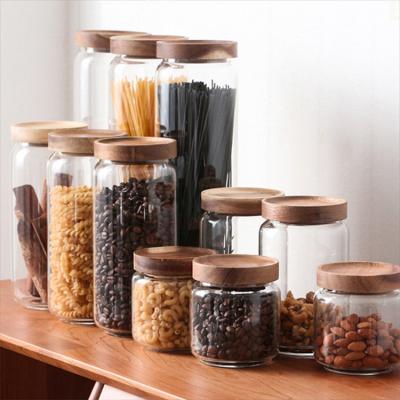 China Custom Capacity Stocked Sealed Clear Round Borosilicate Glass Packaging Containers Jar with Wood Lid for sale