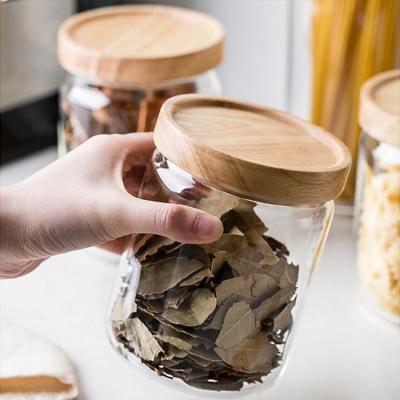 China Custom Capacity Stocked Sealed Clear Round Borosilicate Glass Packaging Containers Jar with Wood Lid for sale