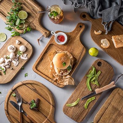 China Mini Acacia Wood Cutting Board with Circle Food Wooden Design and Knife Holder for sale