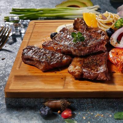Cina Tavola da taglio multifunzionale in bambù con 3 compartimenti e scanalature 43*32*1,8 cm in vendita