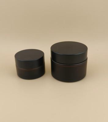 China Vaso di crema in vetro nero dal design accattivante con coperchio a vite per lozione for sale