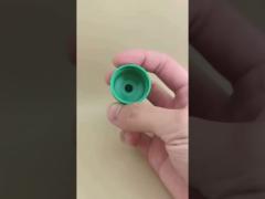green plastic ribbed jelly cap for paint bottles