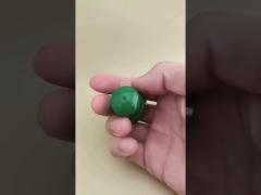 green plastic smooth cap with button for cosmetic bottles