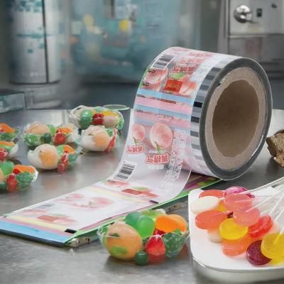 China Custom Printing Sachet Packaging Roll Film Food Grade Pe Bopp Candy Lollipop Chocolate Food Auto-Packaging Roll Film for sale