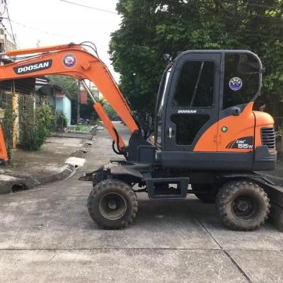 Китай 5 тонн использованный колесный экскаватор Doosan DX55W Mini DX55 с оригинальным гидравлическим клапаном продается
