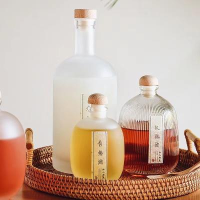 China Yangmei wine bottle, specialized glass bottle for brewing wine, fruit wine packaging vessel for sale