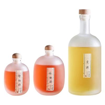 China Yangmei wine bottle, specialized glass bottle for brewing wine, fruit wine packaging vessel for sale