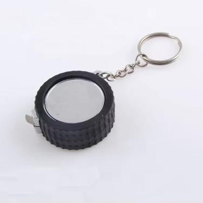 China Custom Logo Auto banden banden in de vorm van promotiegeschenken mini terugtrekbaar stalen band maat sleutelhanger maatband Te koop