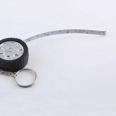 China Custom Logo Auto banden banden in de vorm van promotiegeschenken mini terugtrekbaar stalen band maat sleutelhanger maatband Te koop