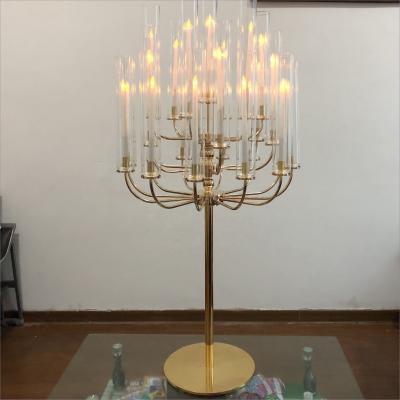 China New wedding decoration tall gold metal candelabra with glass chimney for sale