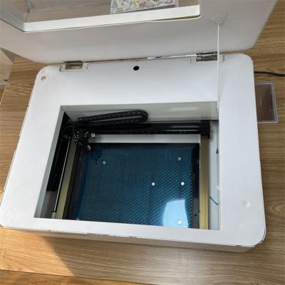 China Customizable Screen Protector Laser Engraving Machine with Circulating Water Cooling for sale