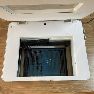 China Indoor Working Environment Supported Screen Protector Laser Cutting Machine with 40KG Weight and PLT Format for sale