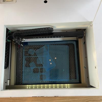 China Indoor Working Environment Supported Screen Protector Laser Cutting Machine with 40KG Weight and PLT Format for sale