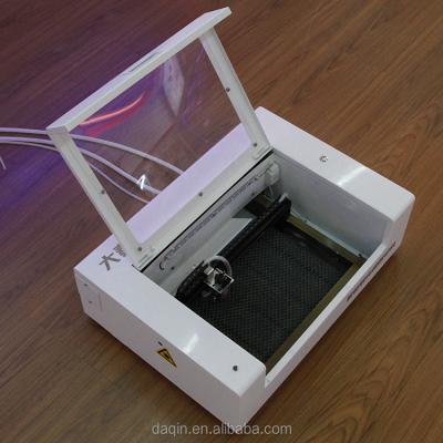 China High Cutting Speed and Laser Engraving System for Screen Protector 40KG for sale
