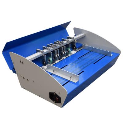 Cina A3 Macchina elettrica per la perforazione della carta con peso di 12 kg e tensione 220/110V 50HZ in vendita