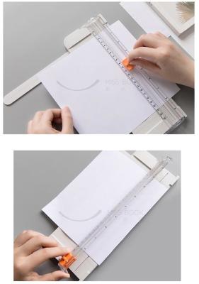 China Máquina de corte de papel de mini-slide azul com régua Espessura de corte 10 folhas de papel de impressão de 80 g à venda