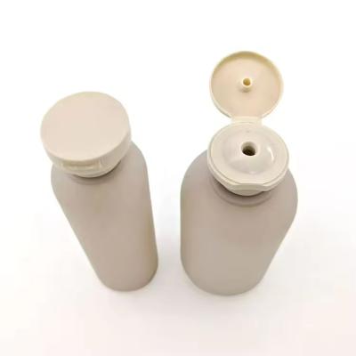 China Round Flip Top Bottles 200ml Plastic Shampoo Bottles Customized for sale