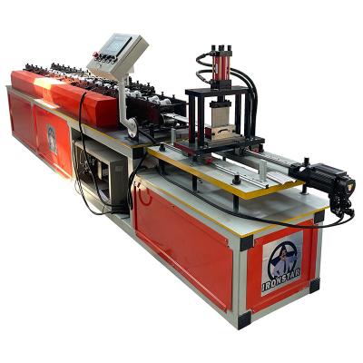 China 30-50m/min fast speed cutting rolling shutter door roll forming machine in Brazil Raw material: Galvanized steel for sale