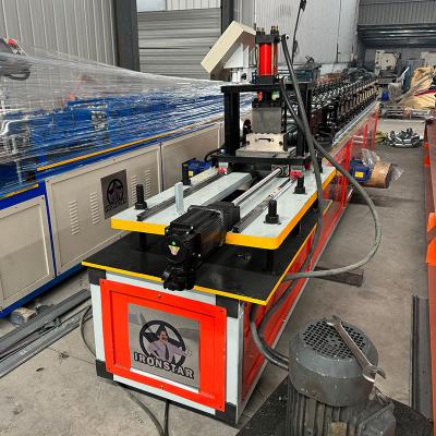 China 30-50m/min fast speed cutting rolling shutter door roll forming machine in Brazil Raw material: Galvanized steel for sale
