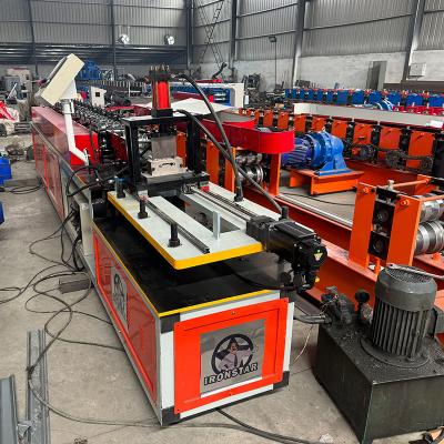 China 30-50m/min fast speed cutting rolling shutter door roll forming machine in Brazil Raw material: Galvanized steel for sale