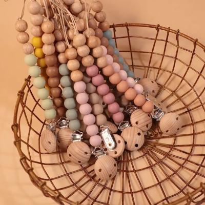 Cina Indolente silicone baby teether manichino catena multiscene non tossico in vendita