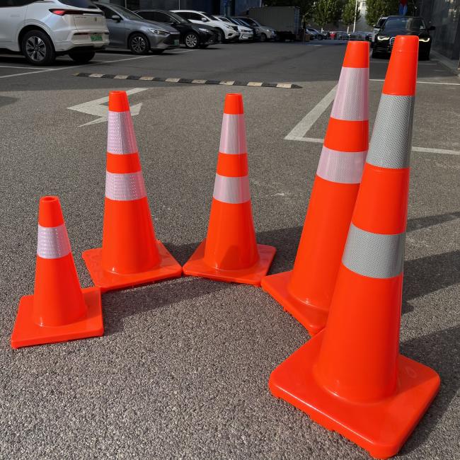 Orange traffic cone with reflective stripes