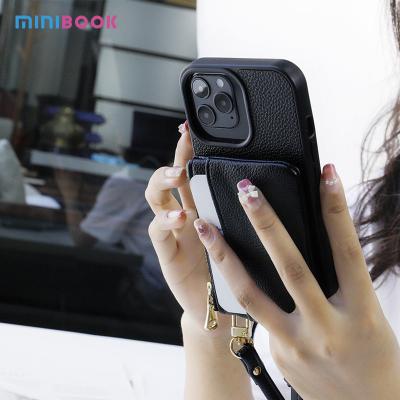 Cina Minibook Cassa per telefono in cuoio con cinghia per iPhone 14 pro max in vendita