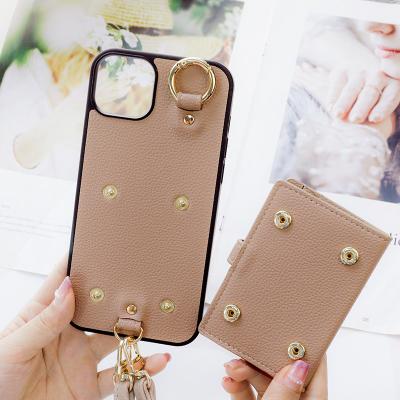 Cina Minibook Cassa per telefono in cuoio con cinghia per iPhone 14 pro max in vendita