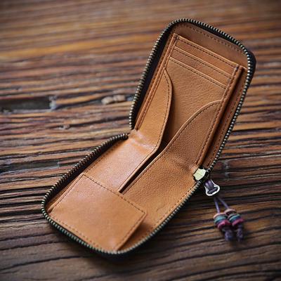 Cina Portafogli di moda da uomo corto e con cerniera fatta a mano con cuoio di mucca retrò in primo strato in vendita
