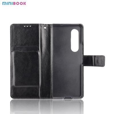 China Minibook Custom Hybrid Shockproof Embossed Logo Flip Wallet Leather Pen Hole Phone Case for sale