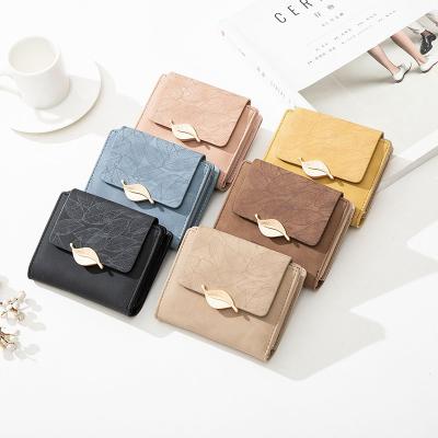 Китай Настроенный логотип PU Leaf Buckle Zipper Folding Student Coin Purse для простых и практичных продается