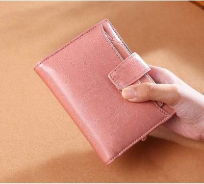 China Minibook Oil Wax Leather Vintage Wallet for Women Short Genuine Leather Coin Purse for sale