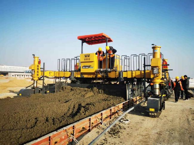 SMC-6600 Slipform Paver in operation on a construction site