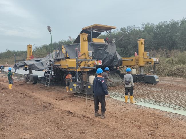 Close-up view of SMC-6800 Slipform Paver's control panel and operator station