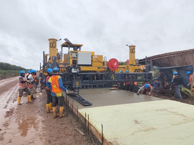 SMC-6800 Slipform Paver in operation showing full machine view