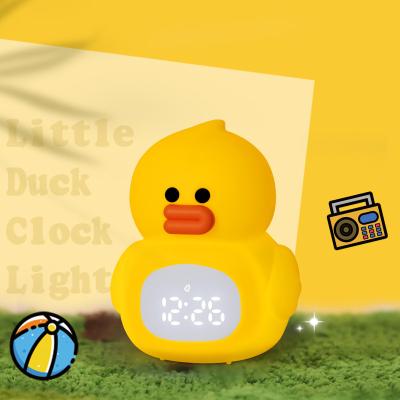 China Relógio de alarme portátil de pato LED com luz noturna recarregável e controlado remotamente para bebês e crianças à venda
