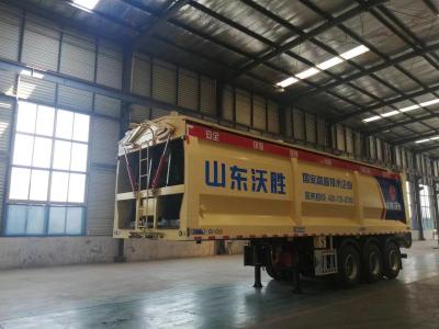 China Rear Dump Semi Trailer with Automatic Crawler Belt Discharge and Max Payload 30-60ton for sale